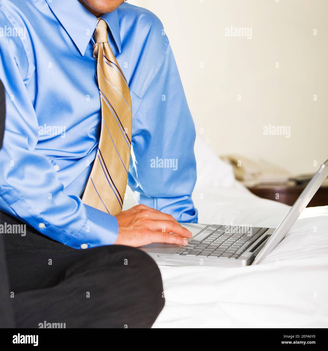 Mid section view of a businessman using a laptop Stock Photo - Alamy