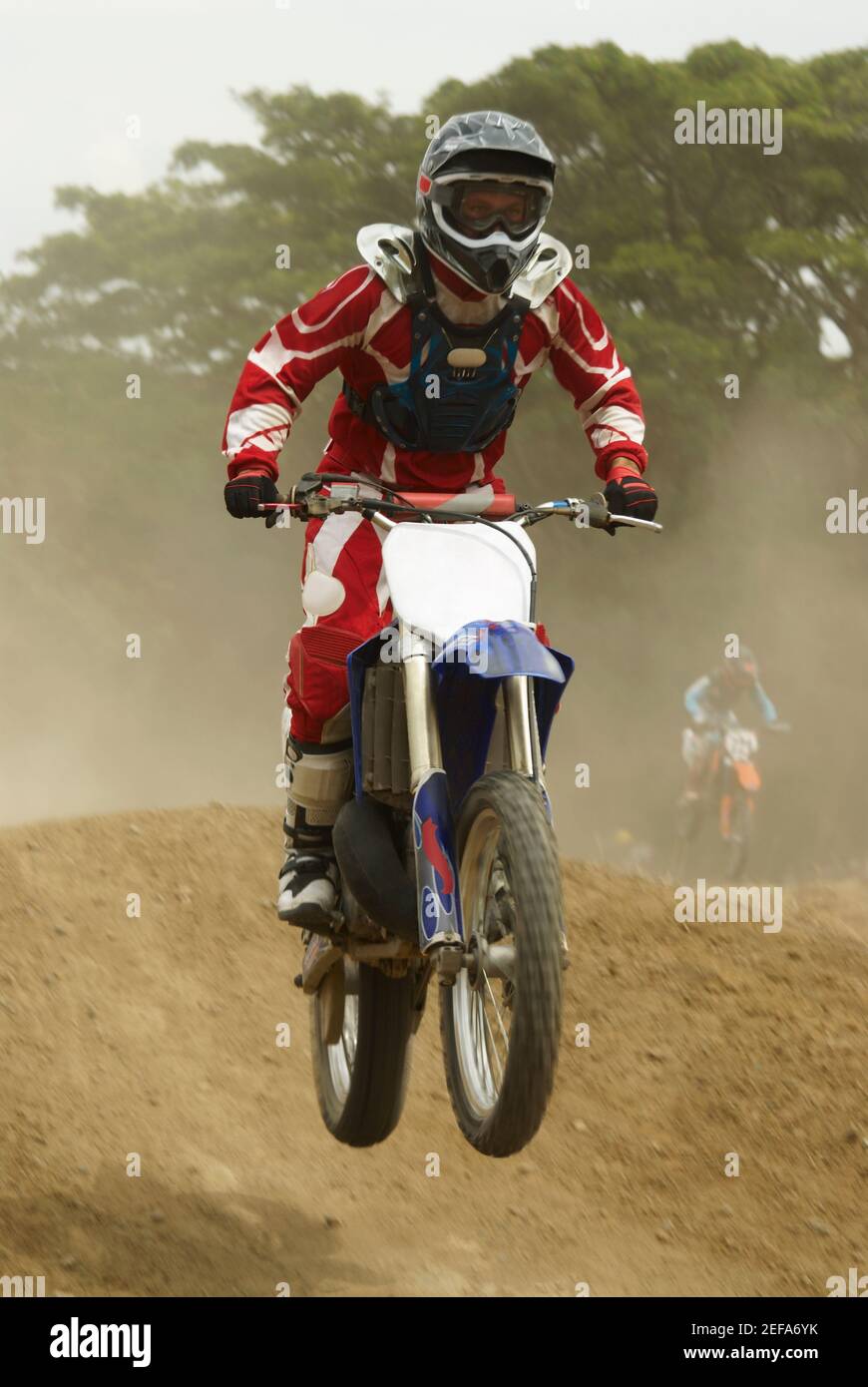 Motocross rider performing a jump on a motorcycle Stock Photo - Alamy
