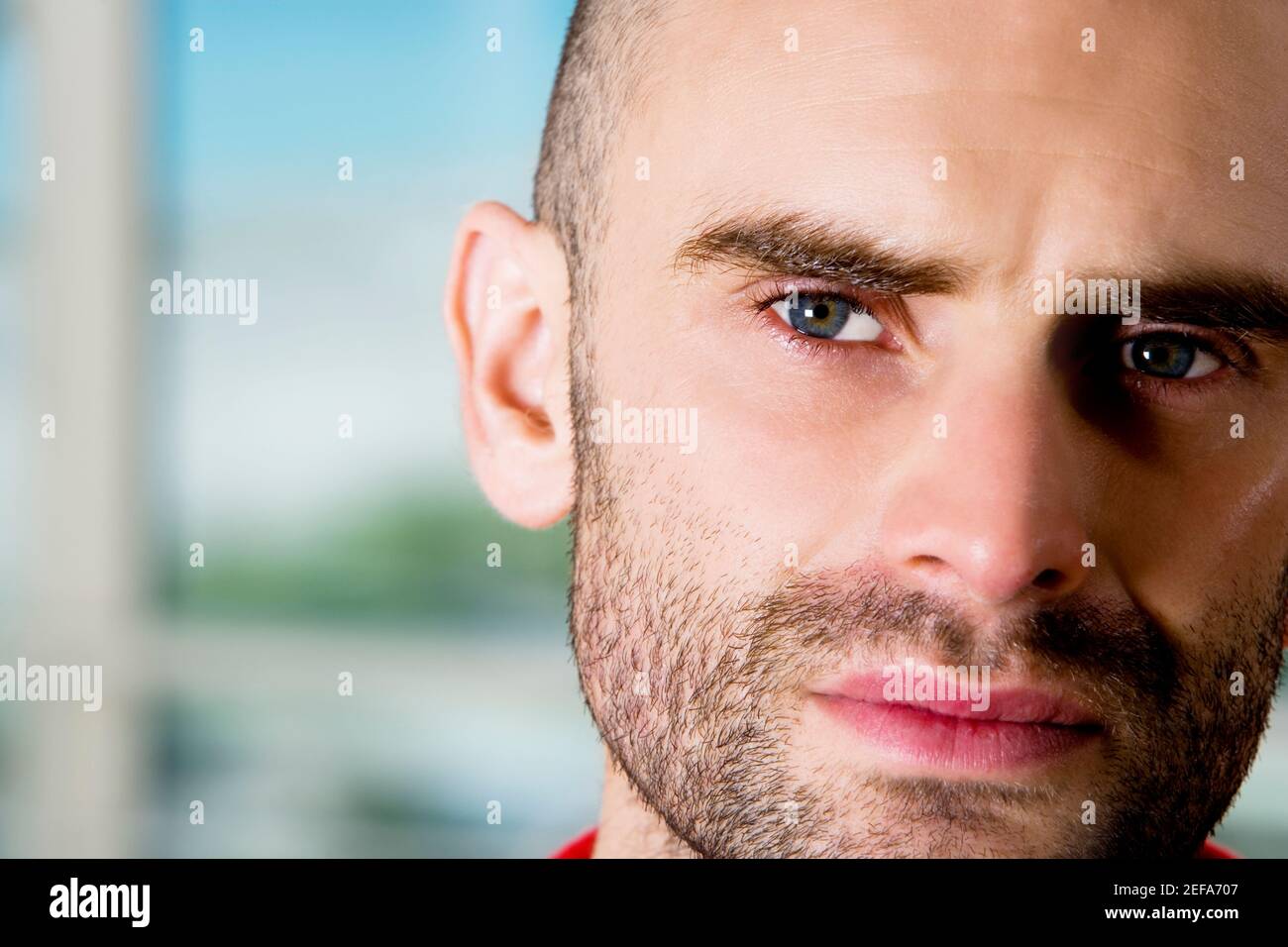 Portrait of a mid adult man looking sad Stock Photo - Alamy