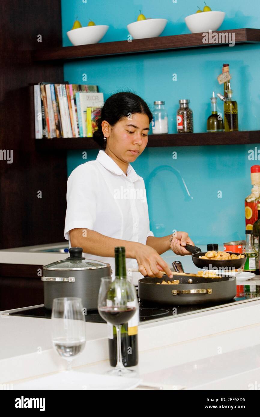 Maid preparing food in the kitchen Stock Photo - Alamy