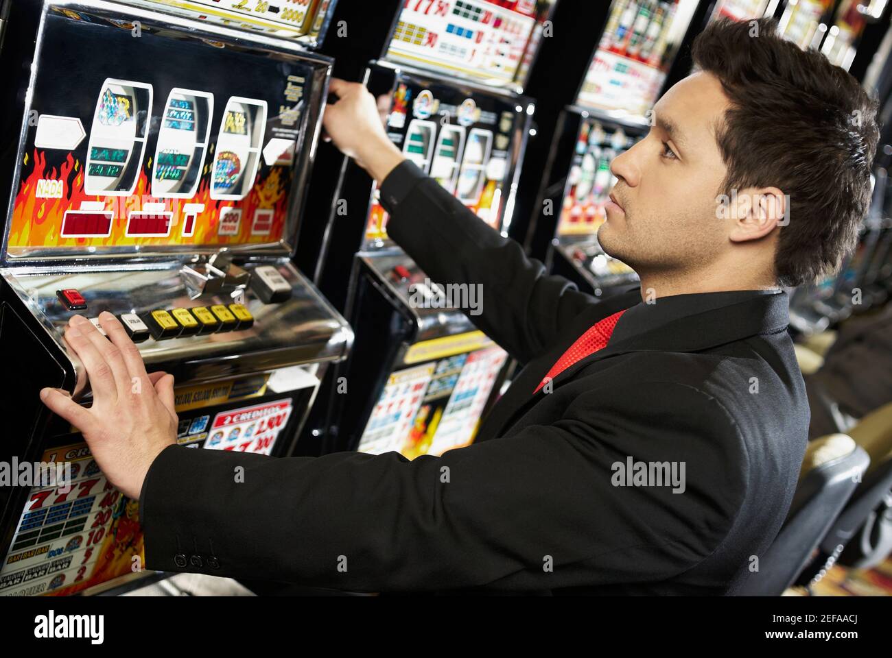 Sitting at gambling machine hi-res stock photography and images - Alamy