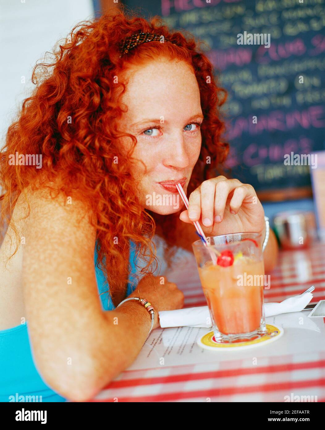 Side profile of a woman drinking with a straw hi-res stock photography and images - Alamy