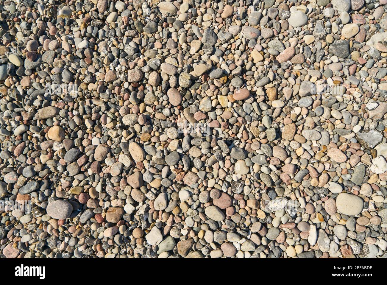 Many pebbles as a stone background structure on the beach Stock Photo ...