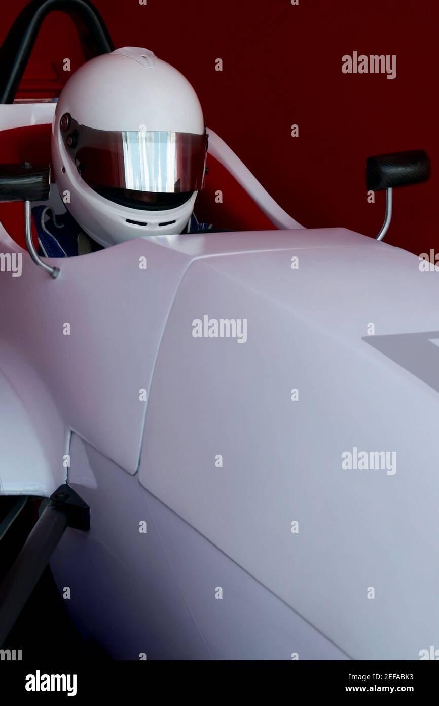Close-up of a racecar driver in a racecar Stock Photo - Alamy