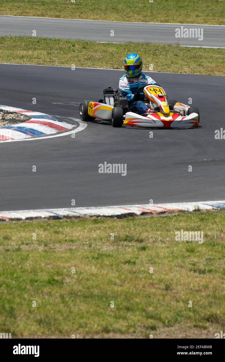 Person go-carting on a motor racing track Stock Photo - Alamy