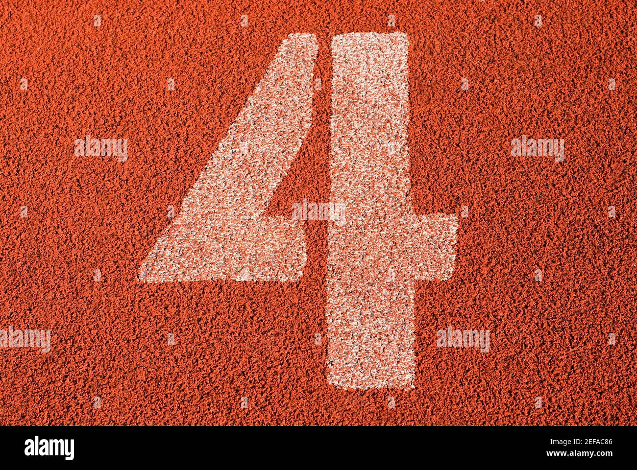 Track number 4 of a running track Stock Photo - Alamy