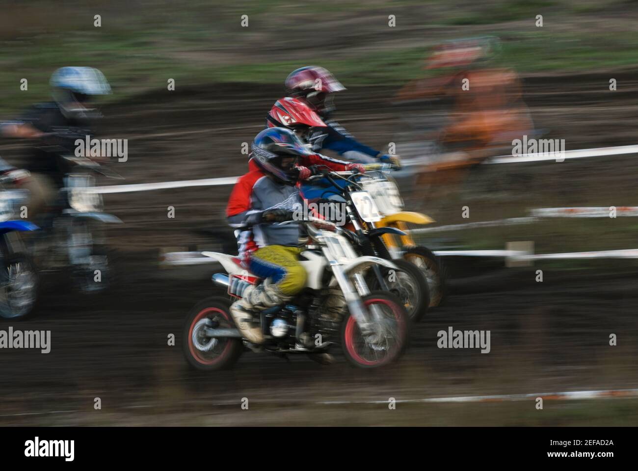Group of men riding motorcycles in a sports race Stock Photo - Alamy