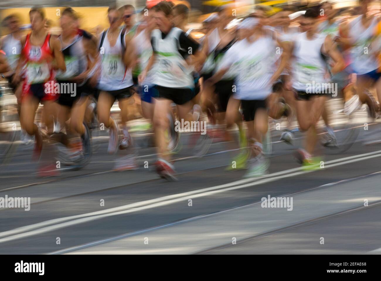 Track athletes running on a running track Stock Photo - Alamy