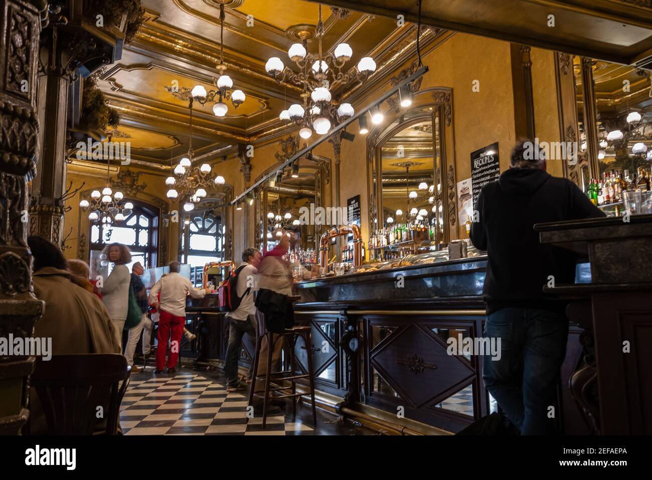 People in the traditional Iruña Cafe in Pamplona, Navarre, Spain. This ...
