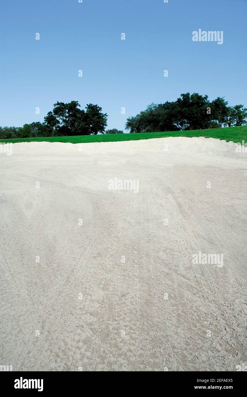 Sand trap in a golf course Stock Photo - Alamy