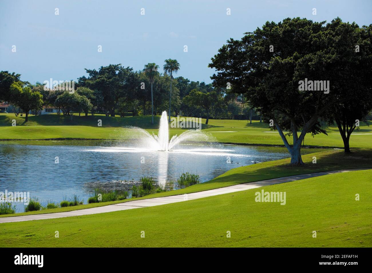 Fountain in a golf course Stock Photo - Alamy