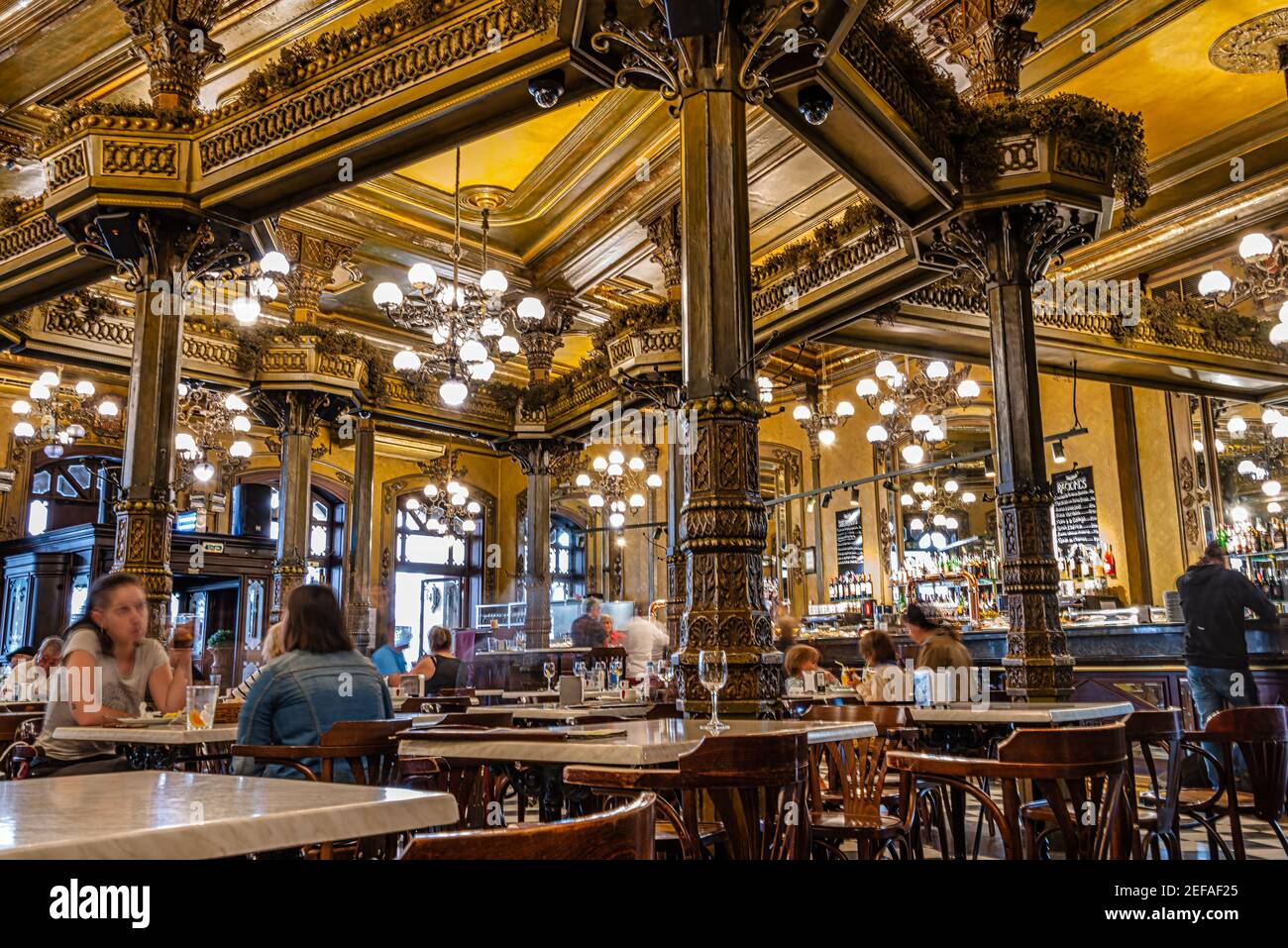People in the traditional Iruña Cafe in Pamplona, Navarre, Spain. This ...