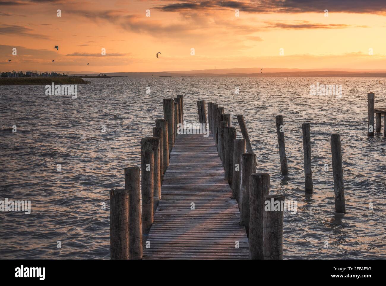Wooden pier in sea sunset hi-res stock photography and images - Alamy
