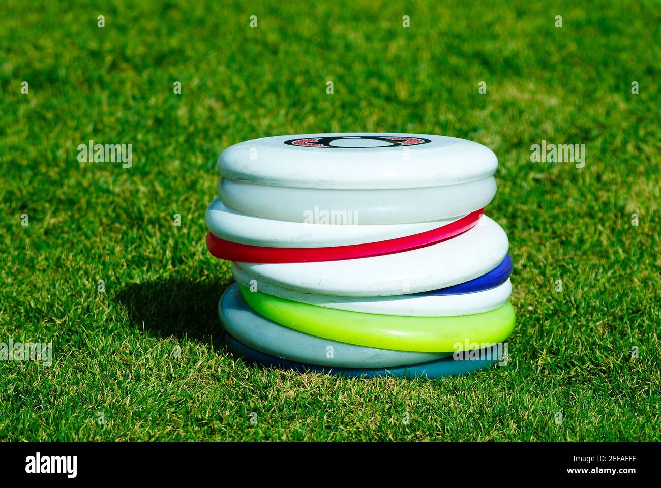 Close up of a stack of plastic discs Stock Photo - Alamy
