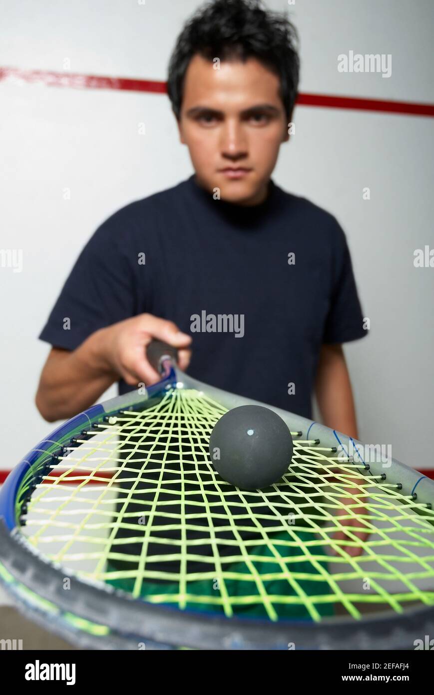 Man playing squash hi-res stock photography and images - Alamy