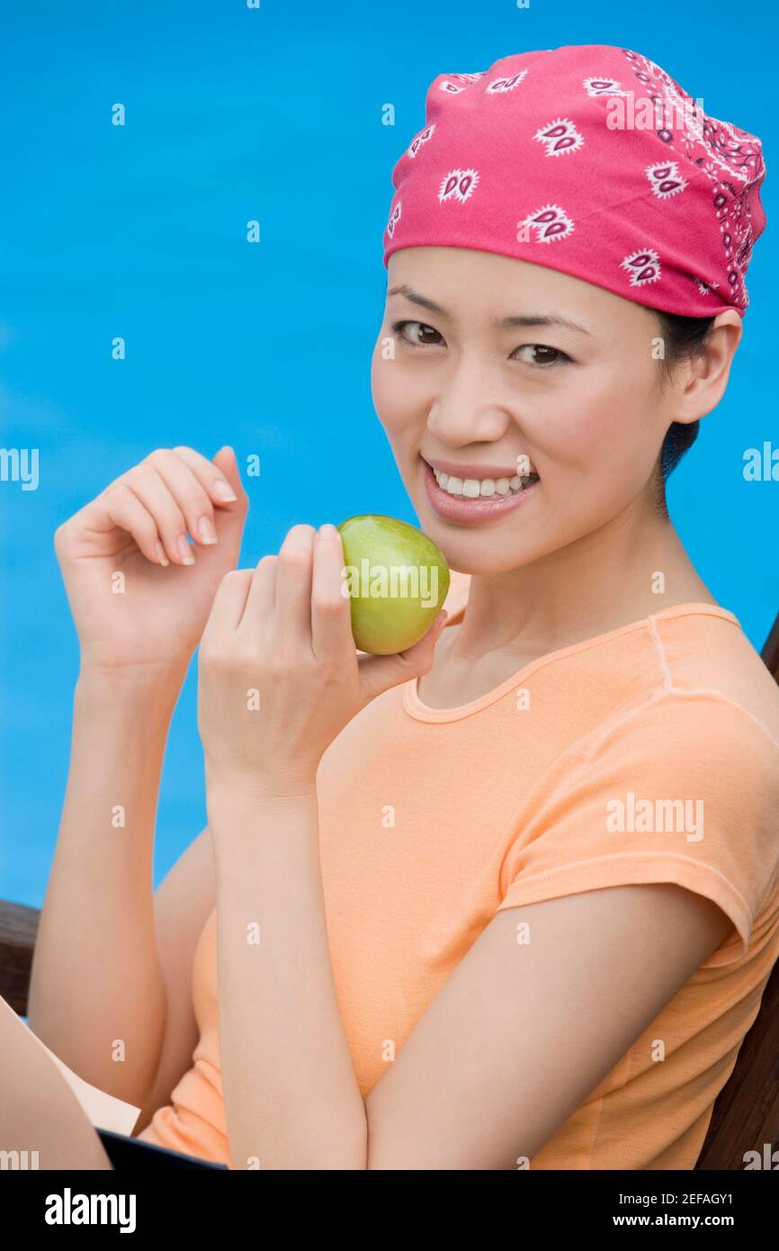 Portrait of a young woman eating an apple hi-res stock photography and ...