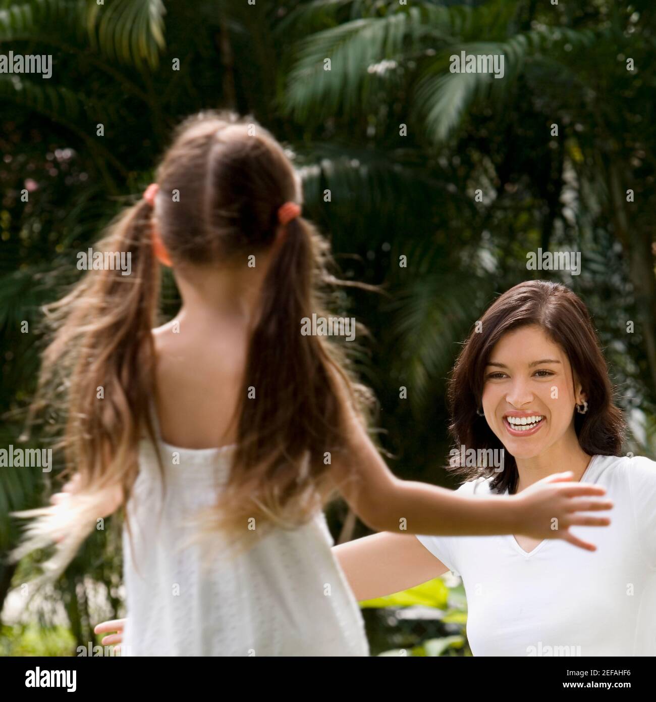 Mother girl hug rear view hi-res stock photography and images - Alamy