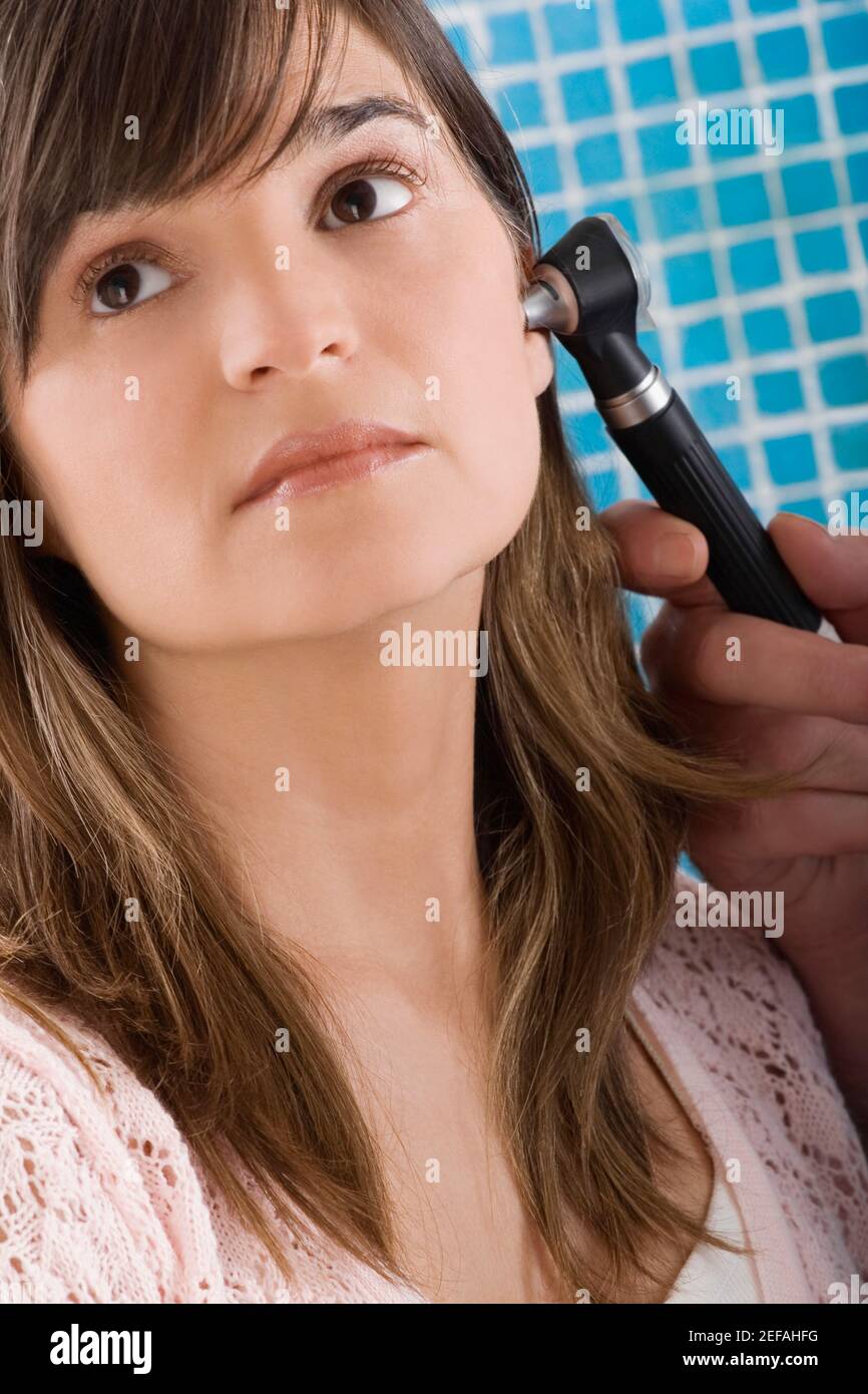 Ear inspection woman hi-res stock photography and images - Alamy