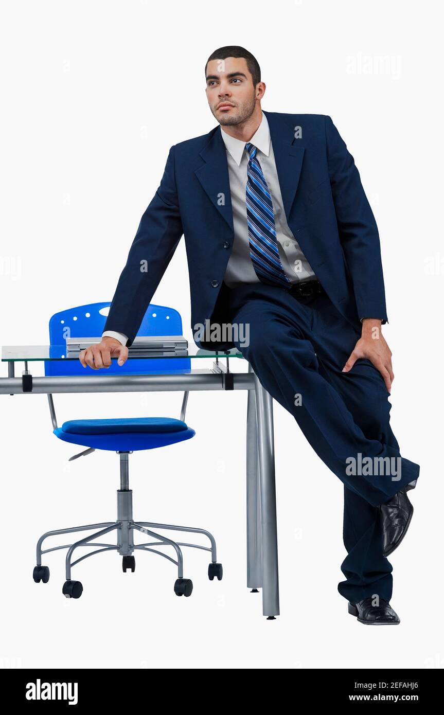 Man sitting desk full view Cut Out Stock Images & Pictures - Alamy