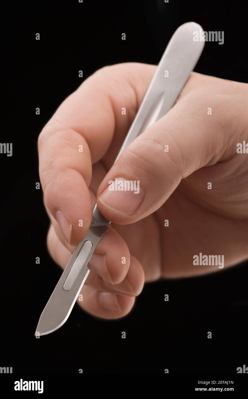 Hand with a scalpel hi-res stock photography and images - Alamy