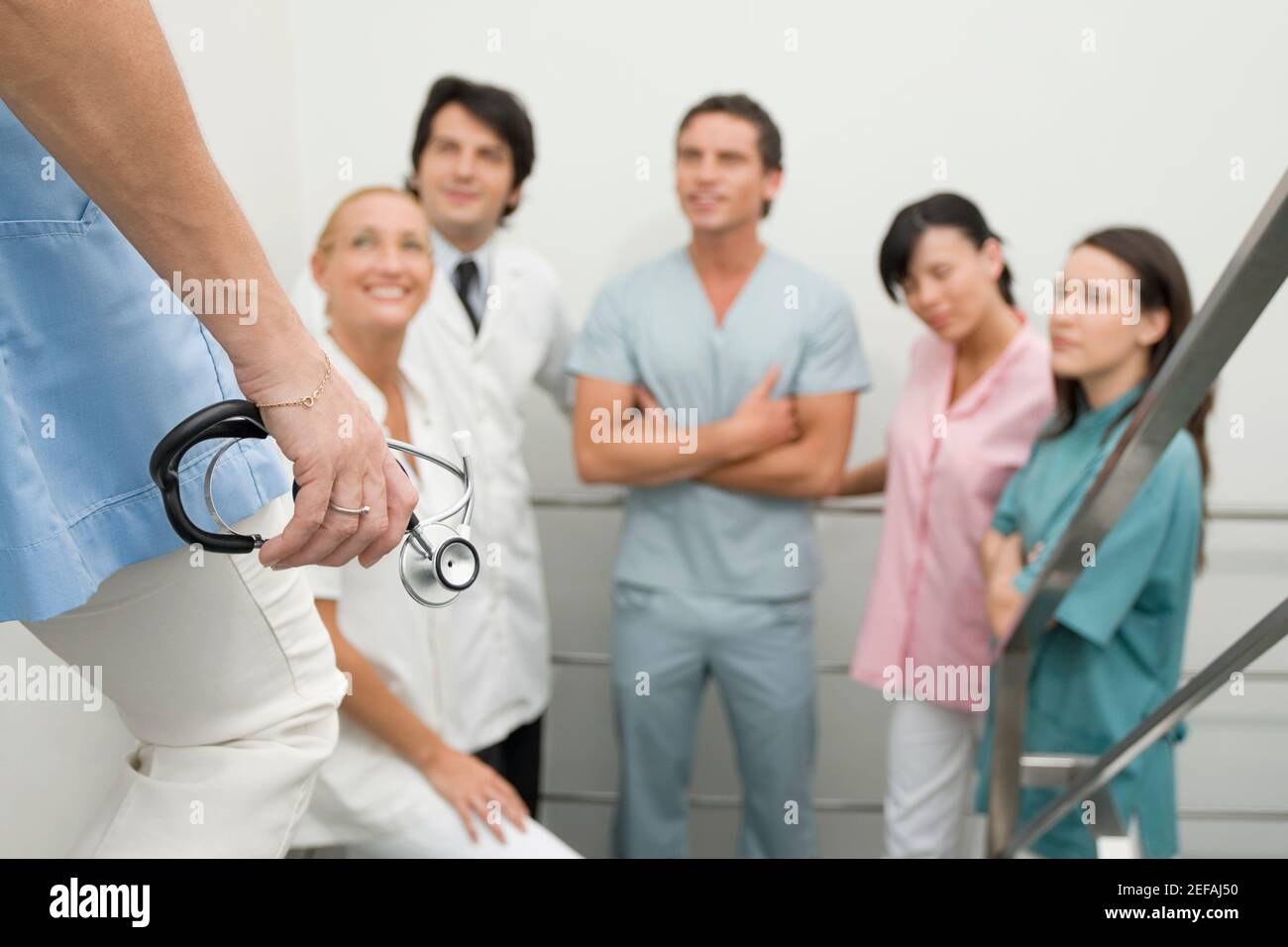 Doctors standing together and smiling Stock Photo - Alamy