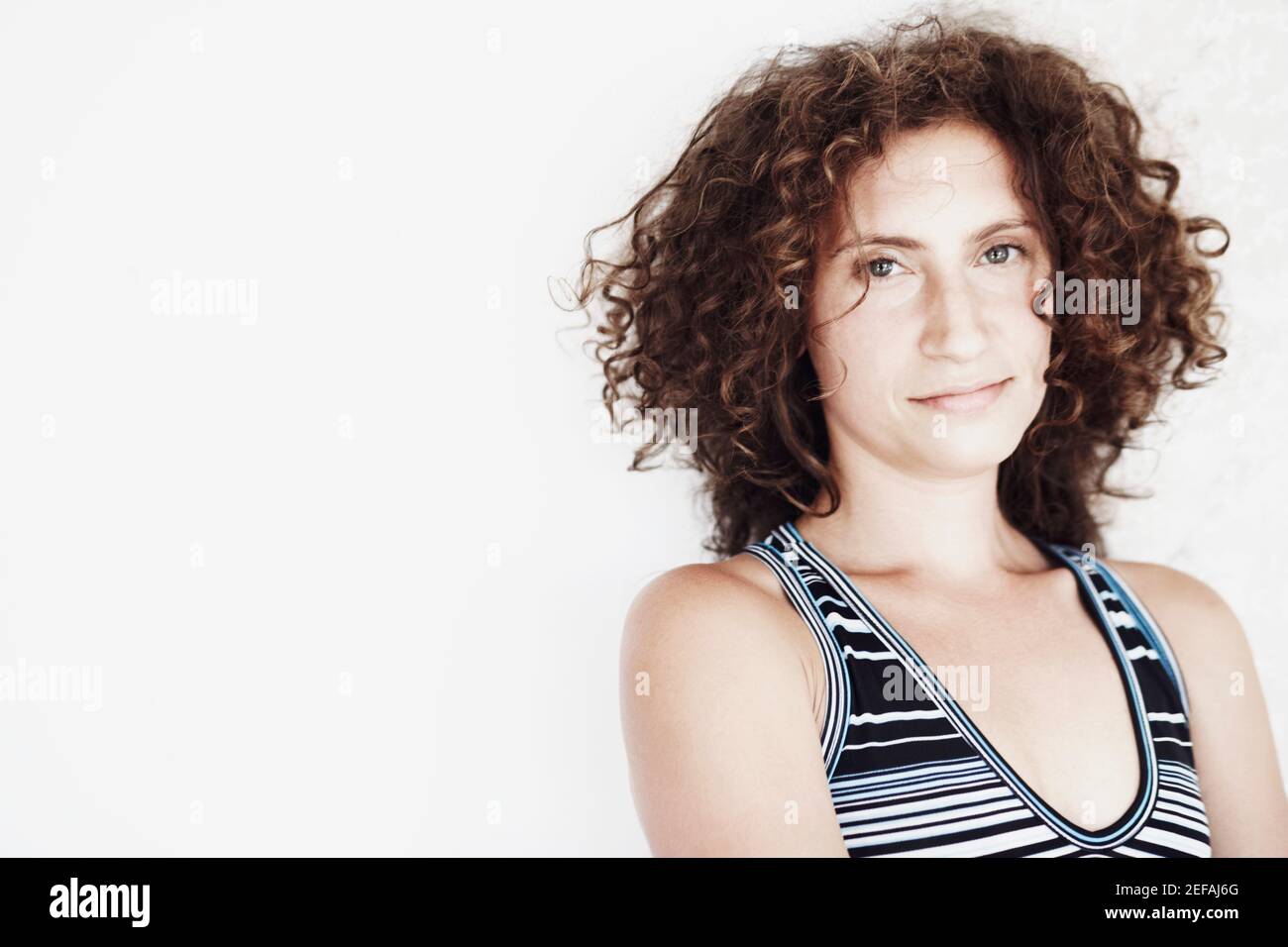 Beautiful woman smirking hi-res stock photography and images - Alamy