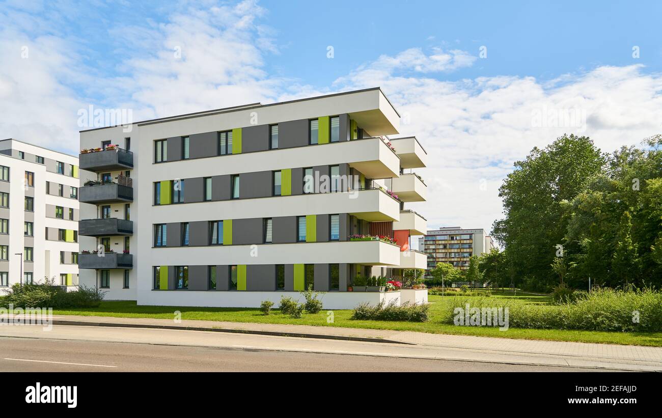 Green housing estate with an apartment building in a prefabricated ...