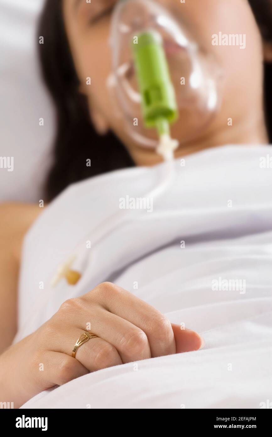 Young woman wearing oxygen mask hi-res stock photography and images - Alamy