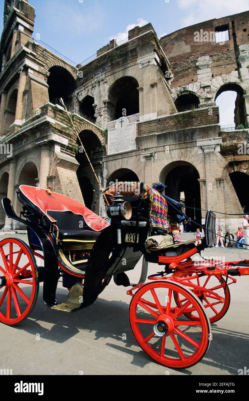 Horse drawn carriage in front of a colosseum, Rome, Italy Stock Photo ...