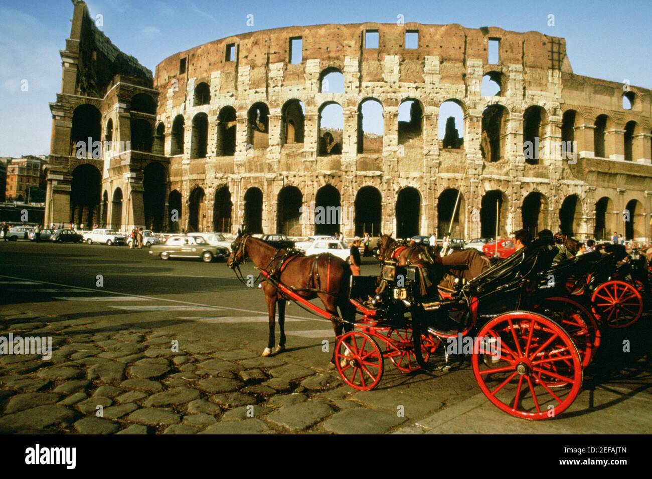 Horse drawn carriage in front of a colosseum, Rome, Italy Stock Photo ...