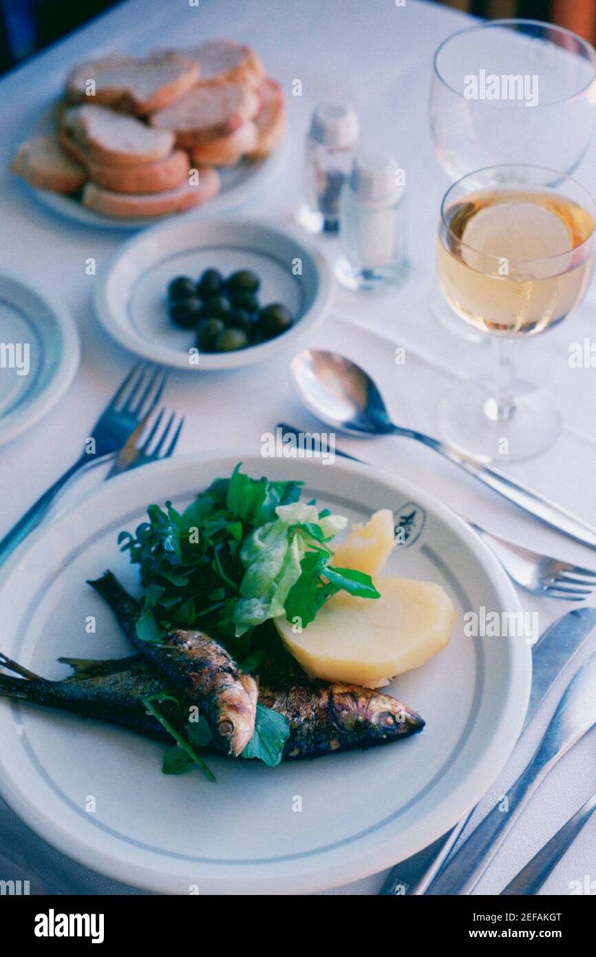 Cooked fish in a plate Stock Photo - Alamy