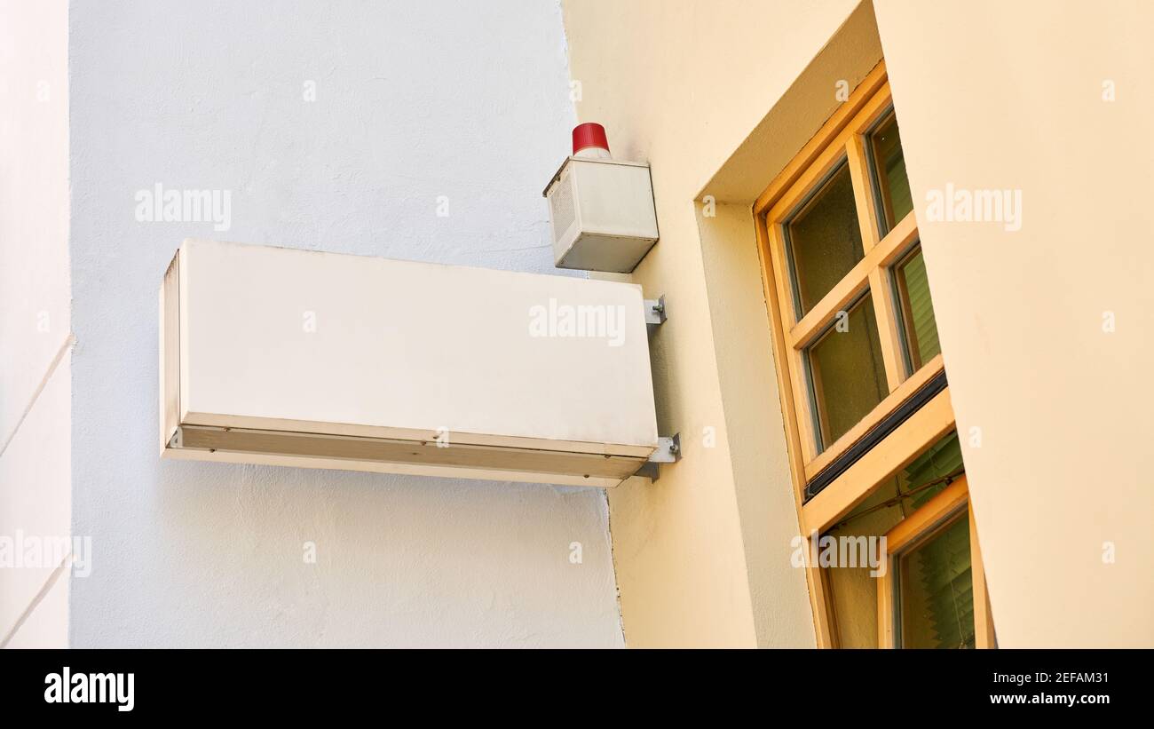 Alarm system with blank sign mock-up template in front of office or ...