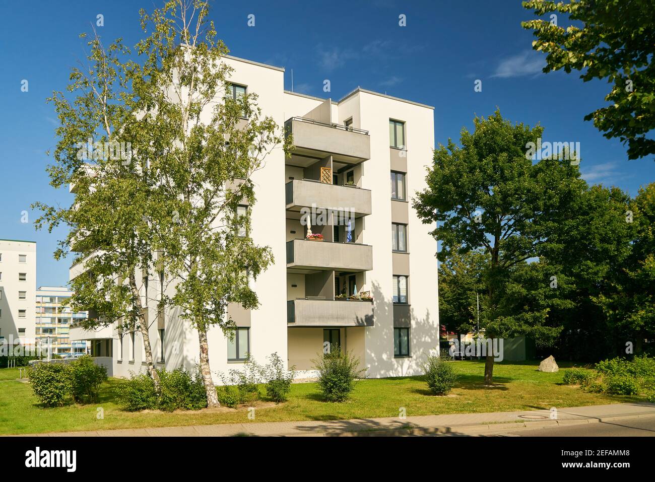 Modern detached apartment house with a garden in nature in summer Stock ...