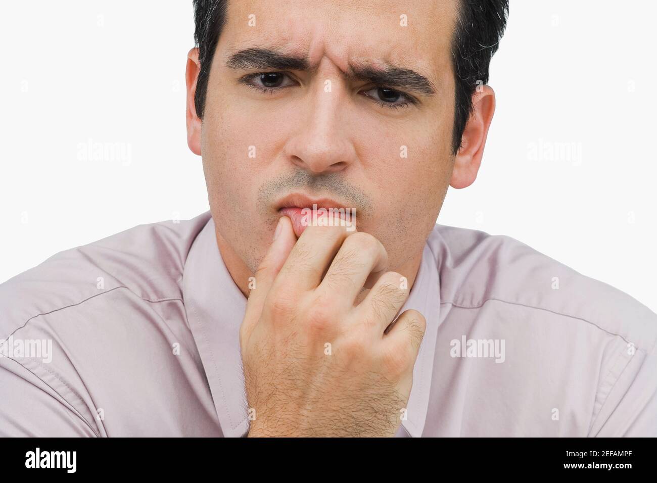 Portrait of a businessman thinking with his hand on his chin Stock ...
