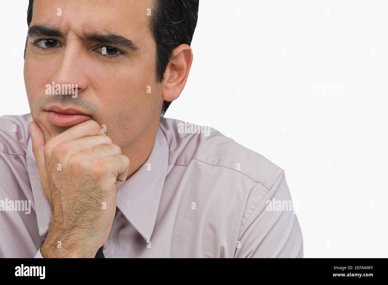 Portrait of a businessman thinking with his hand on his chin Stock ...