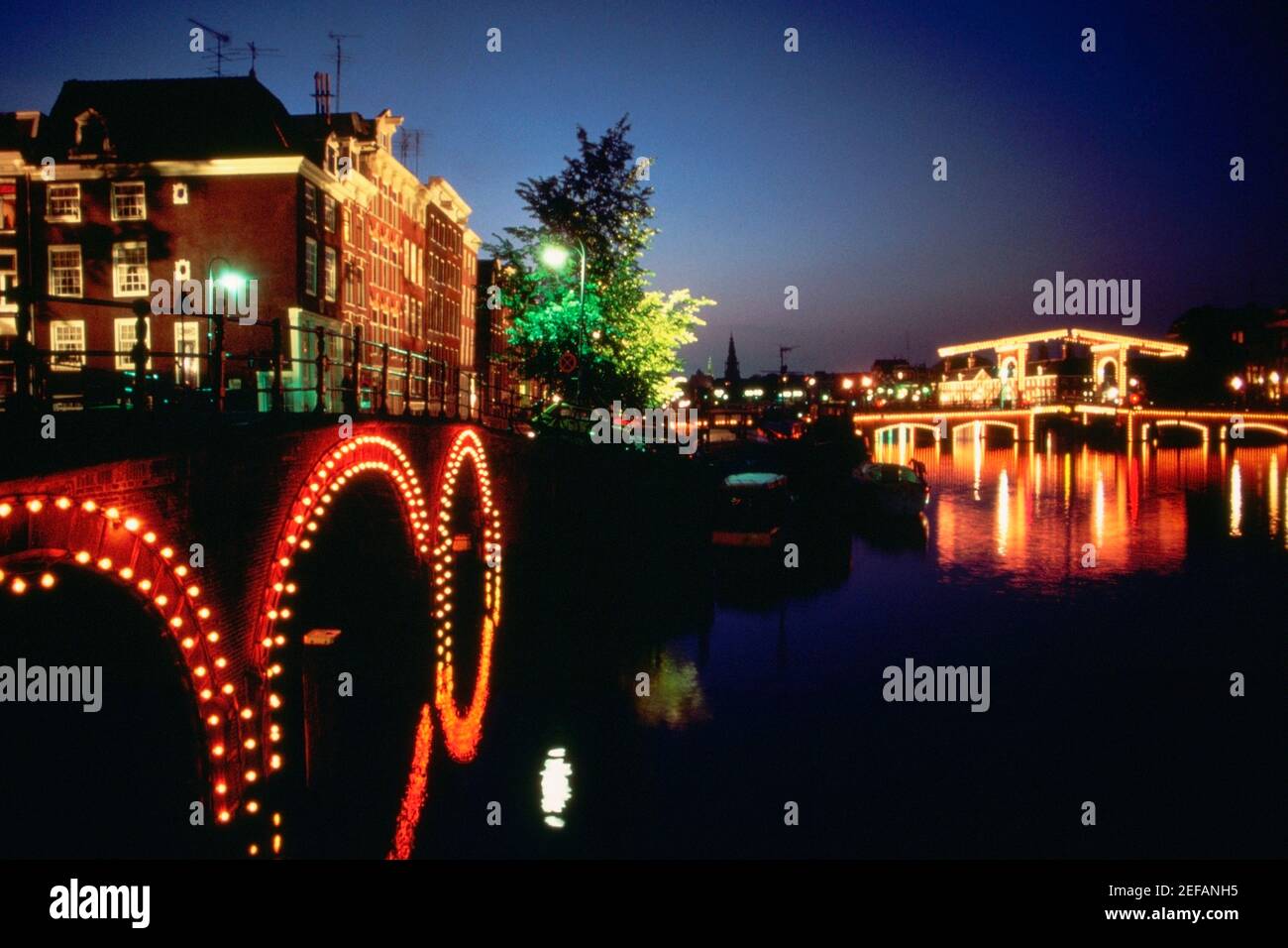 Arch bridge across a canal, Amsterdam, Netherlands Stock Photo - Alamy