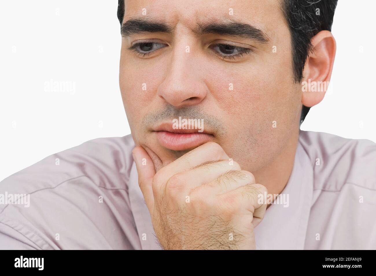 Close up of a businessman thinking with his hand on his chin Stock ...