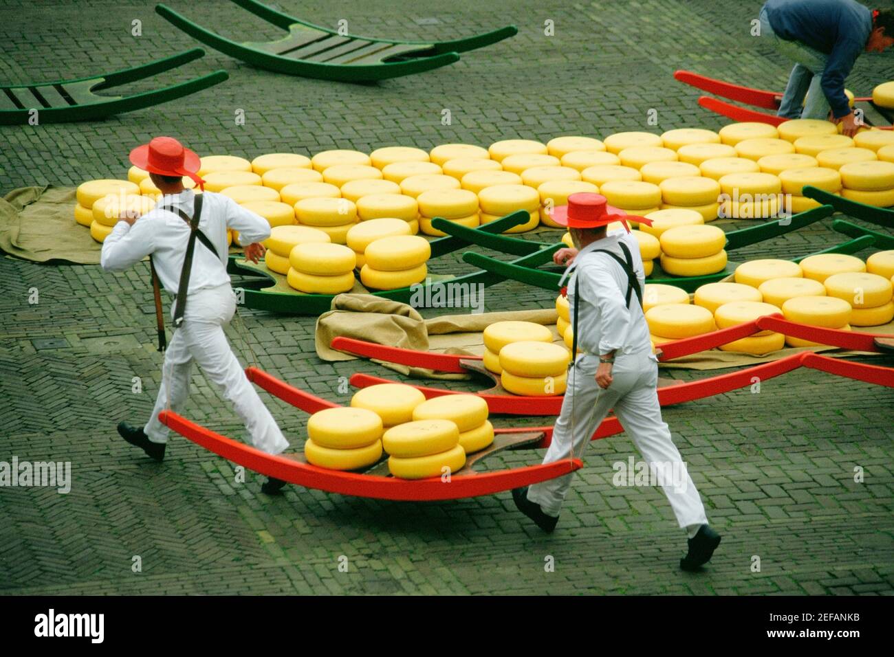 Men carrying cheese hi-res stock photography and images - Alamy