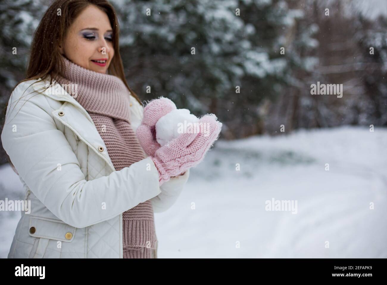 Lady making snowball hi-res stock photography and images - Alamy
