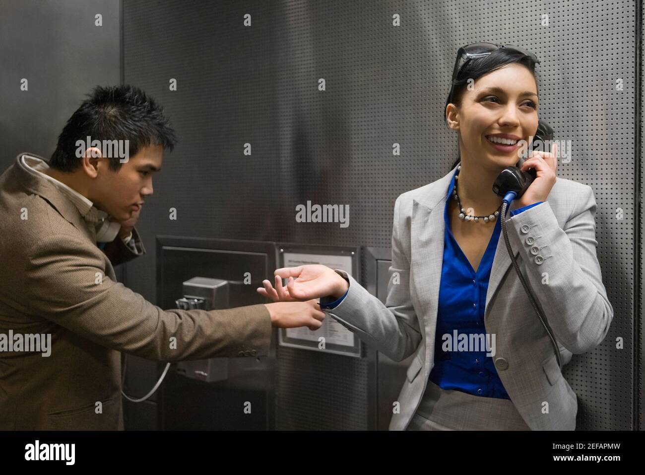 Businessman talking payphone hi-res stock photography and images - Alamy
