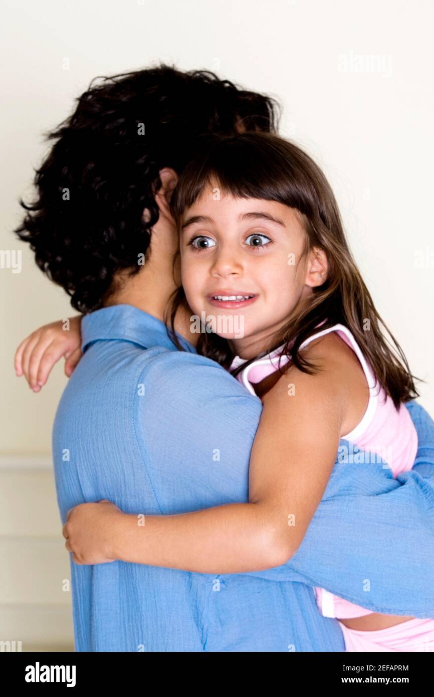 Side profile of a father carrying his daughter Stock Photo - Alamy