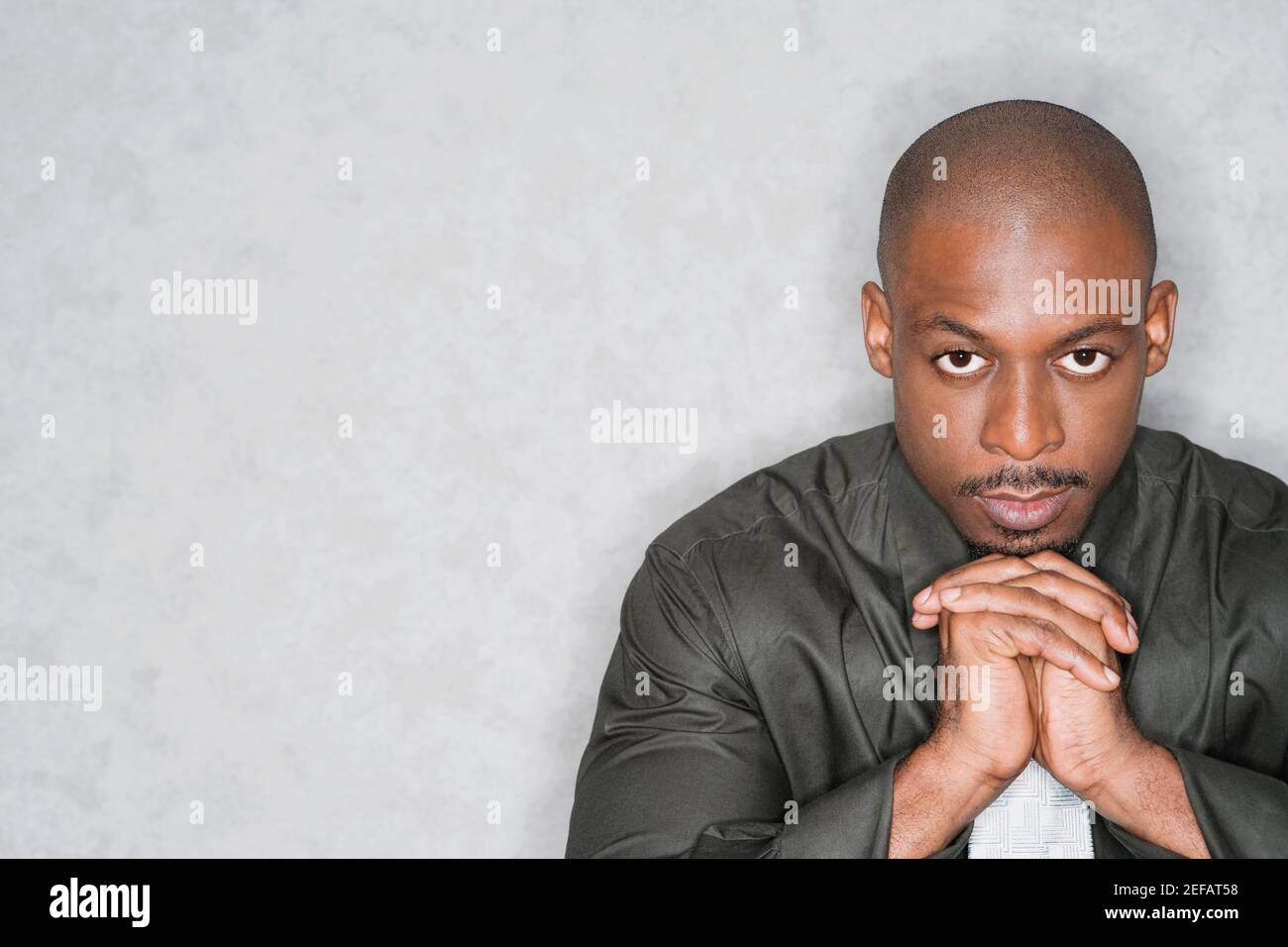 Portrait of a businessman looking serious Stock Photo - Alamy