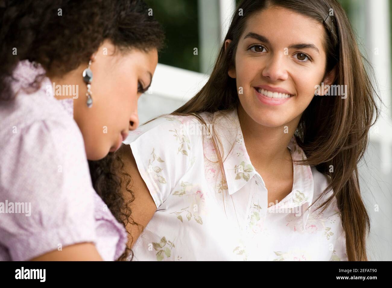 Portrait of two university students smiling Stock Photo - Alamy