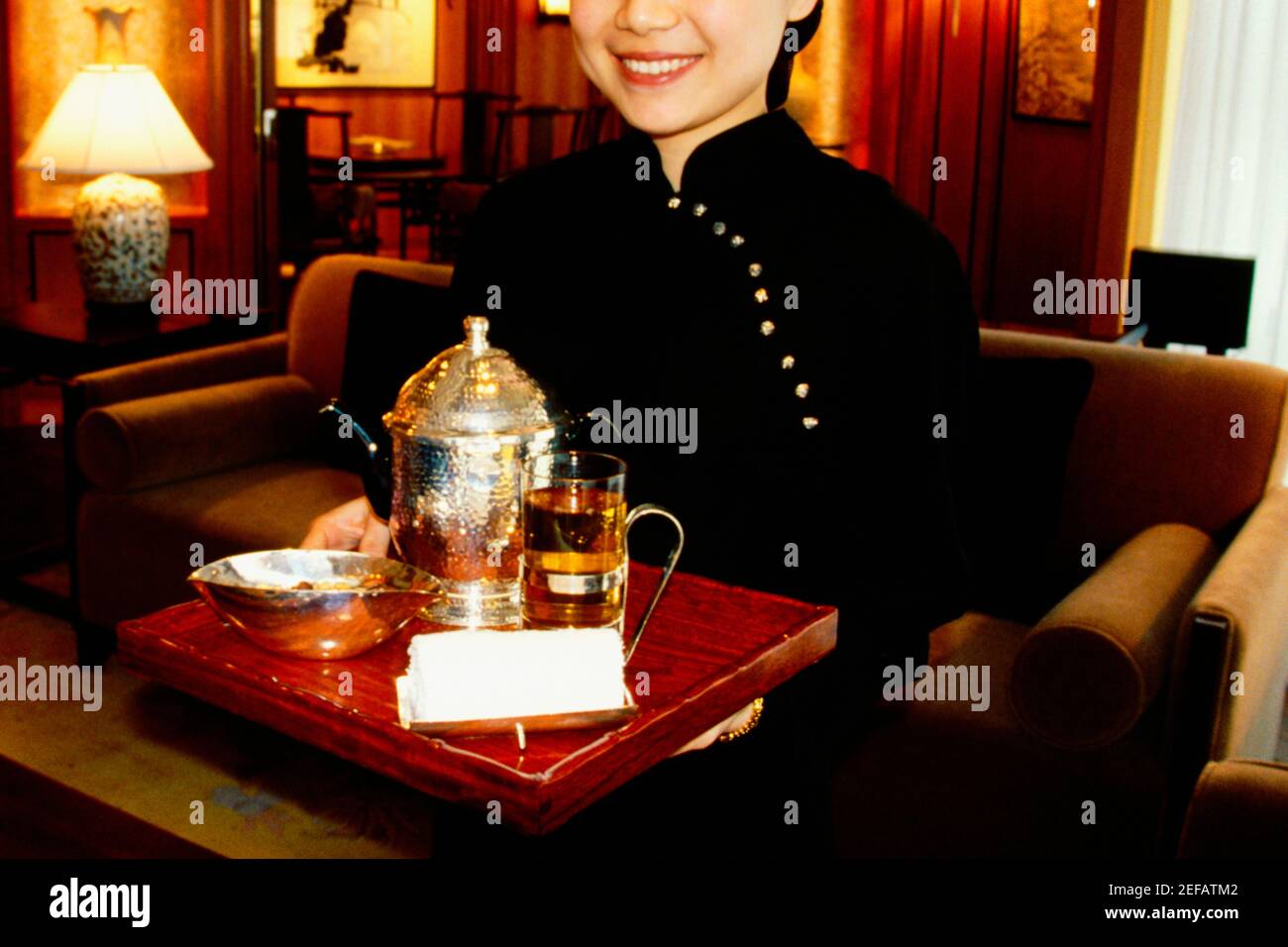 Waitress serving tea hospitality hi-res stock photography and images ...