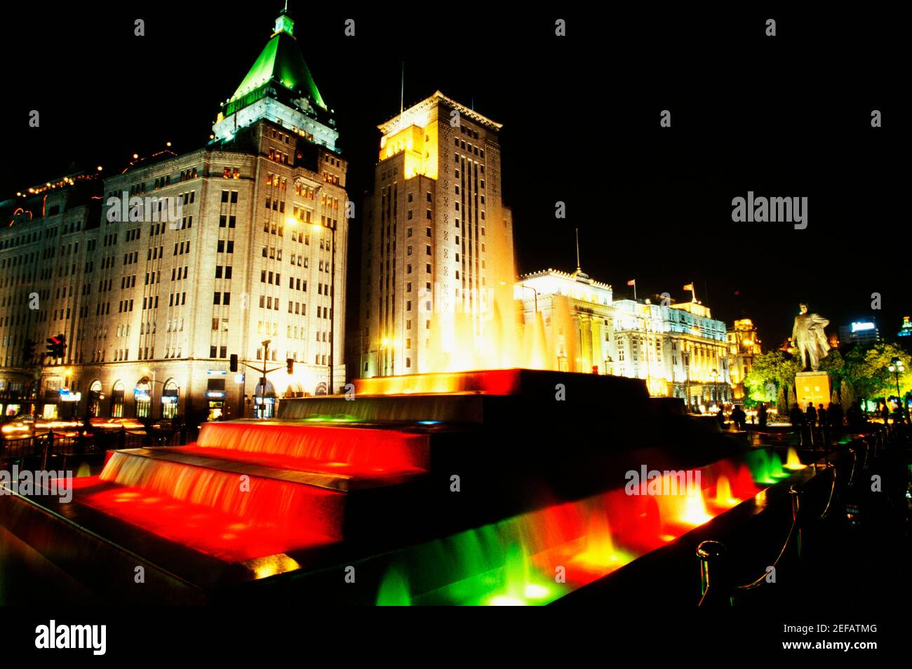 Buildings and fountains lit up at night, The Bund, Shanghai, China ...