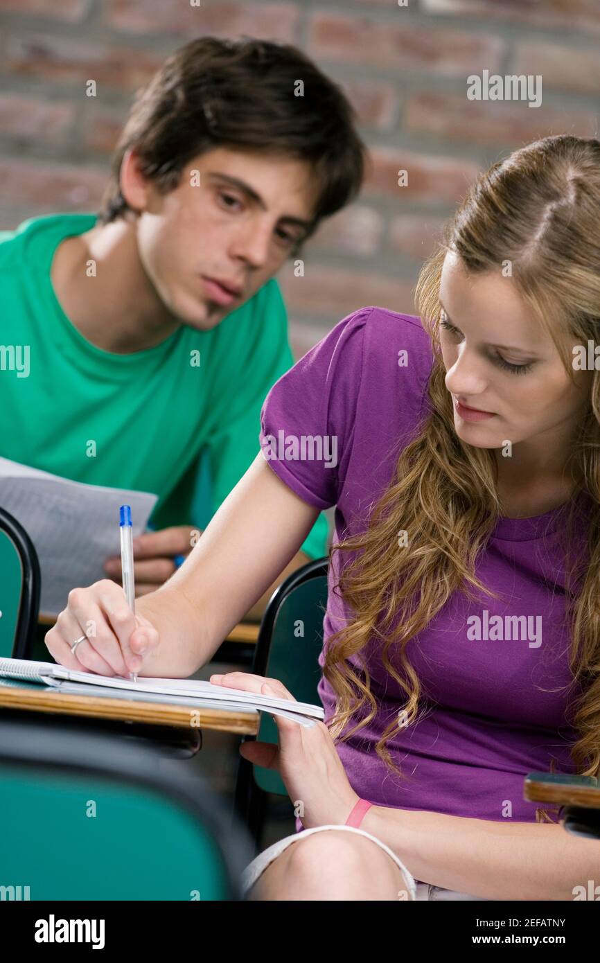 Two university students studying in a classroom Stock Photo - Alamy