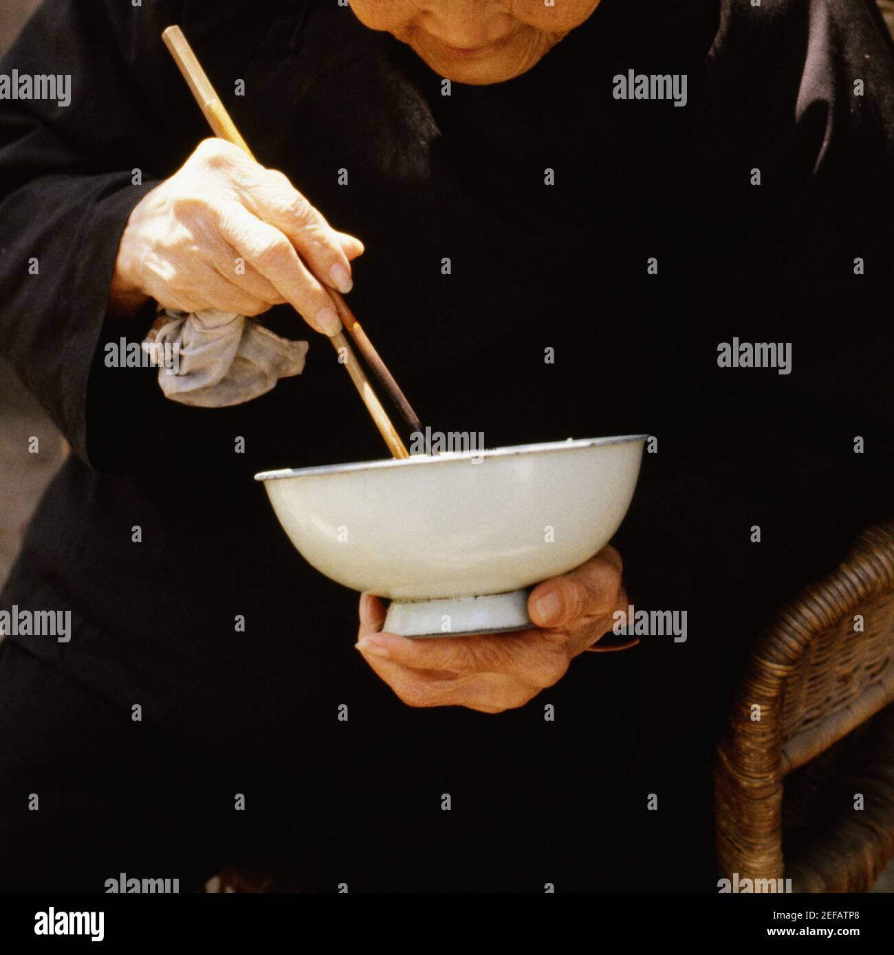 Man eating with chopsticks hi-res stock photography and images - Alamy