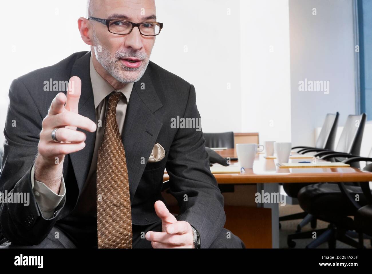 Business man point board hi-res stock photography and images - Alamy