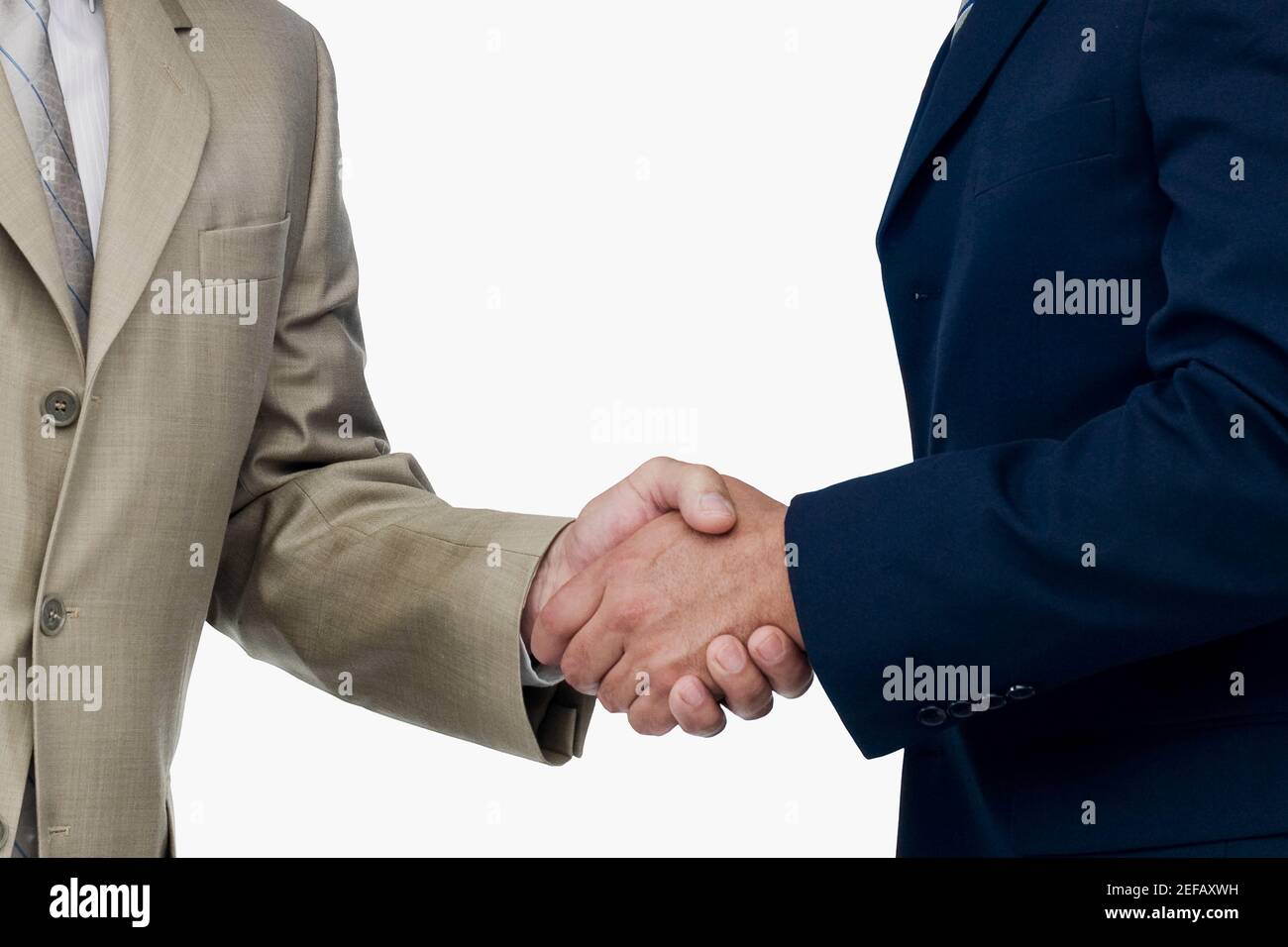 Mid section view of two businessmen shaking hands Stock Photo - Alamy