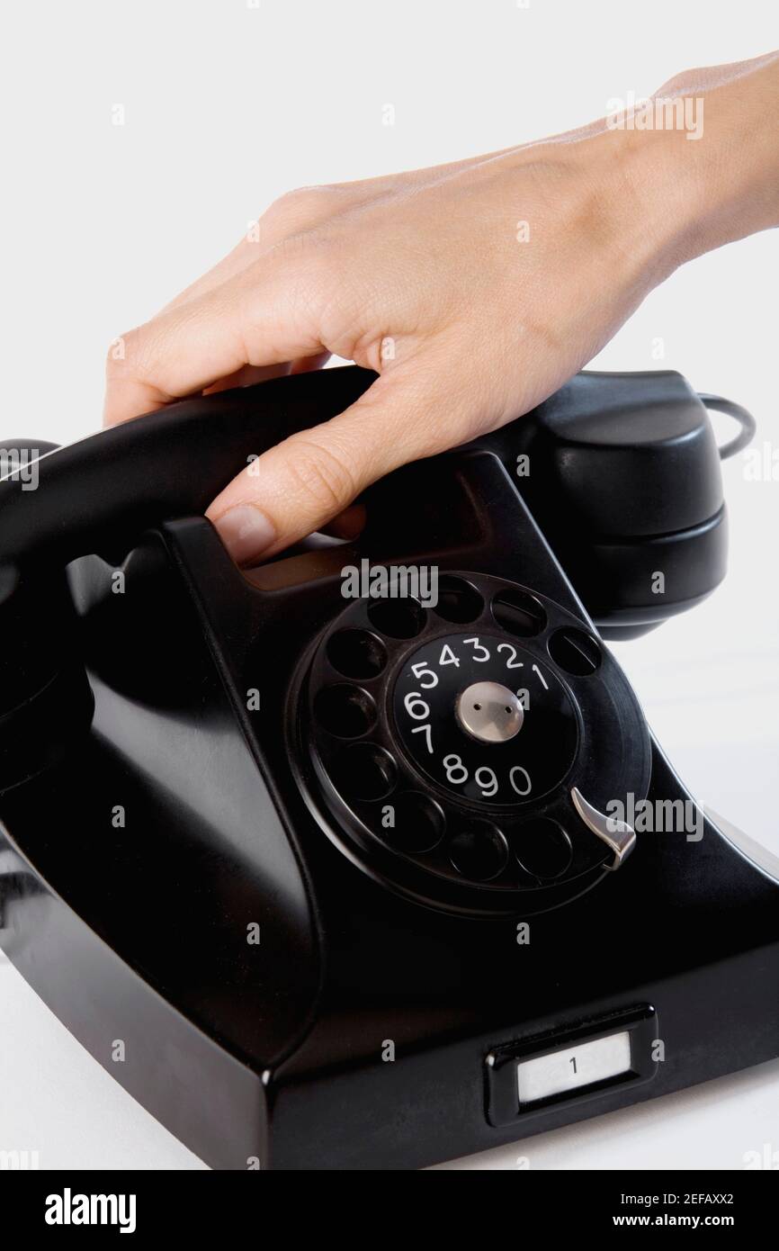 Hand holding telephone hi-res stock photography and images - Alamy